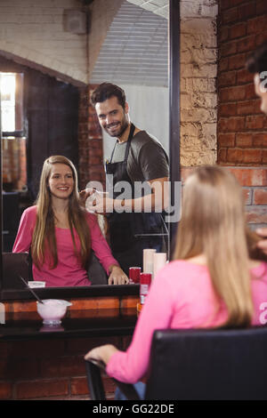 Hairdresser Advising Hair Color To Client Stock Photo - Alamy