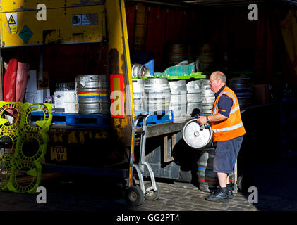 Man loading beer barrels onto lorry, York, North Yorkshire UK Stock ...
