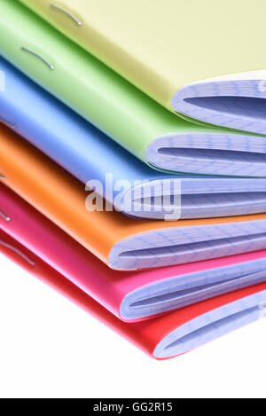 Pile of book and exercise books with school applies and apple snack ...