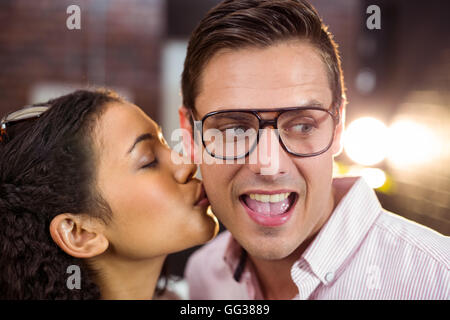 beautiful businesswoman kissing man on cheek on the street Stock Photo ...