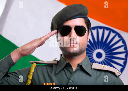 Security guard saluting with Indian flag in the background Stock Photo ...