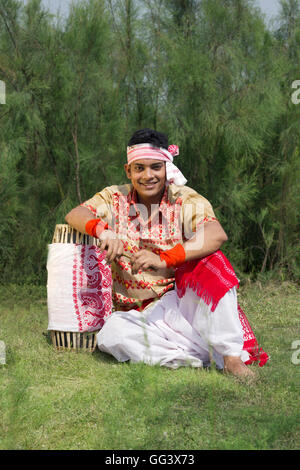 Portrait of a Bihu dancer sitting with a dhol Stock Photo - Alamy