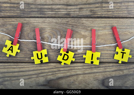 Puzzle pieces with word Audit Stock Photo - Alamy