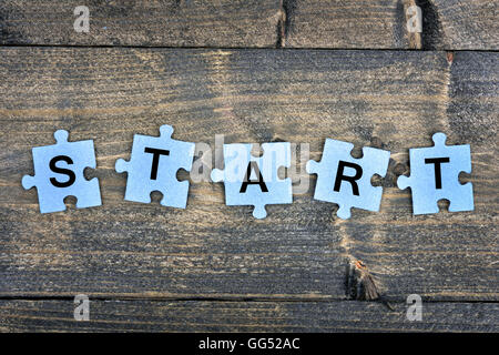 Puzzle pieces with word Start Stock Photo - Alamy