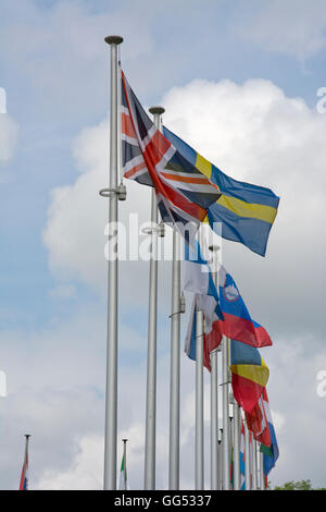 Flag posts with the waving flags of the United States on a sunny day ...