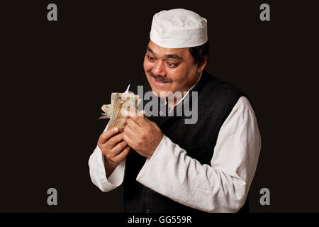 Indian politician taking bribes Stock Photo - Alamy