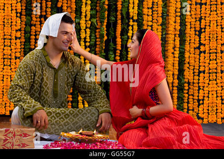 Sister applying tika on her brother's forehead on the occasion of ...