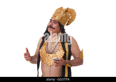 Man dressed as Raavan with a mobile phone laughing Stock Photo - Alamy