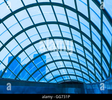 Scene of modern construction of arch ceiling over the glass pathway ...
