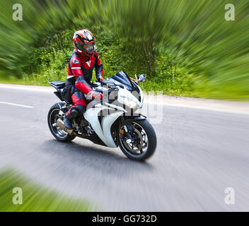 motorcyclist biker fast riding Stock Photo - Alamy