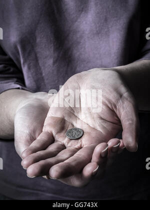 Woman giving money to poor homeless man with Help sign outdoors ...
