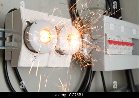 Overloaded electrical circuit causing electrical short and fire Stock ...