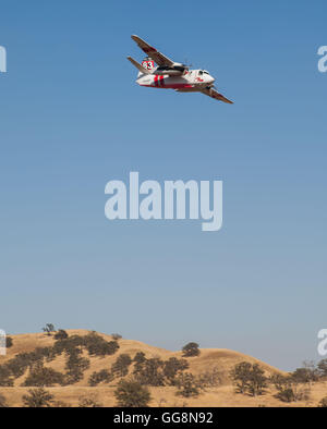 Diablo Grande, CA, USA. 3rd Aug, 2016. CalFire tanker 74 drops a load ...