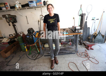Napa, CA, USA. 7th July, 2016. Sparks fly as blacksmith Julie Henry ...