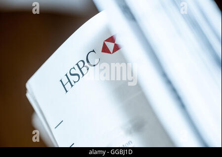 Signage and cheque books with logo from HSBC Bank Stock Photo - Alamy