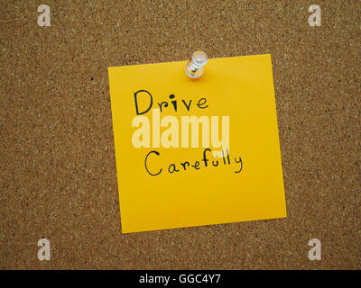 Drive carefully on post note attach in car for someone Stock Photo - Alamy