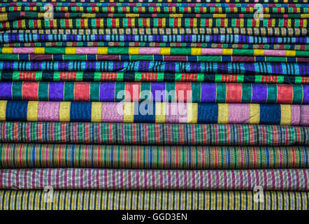 heap of oriental textiles in draper's shop at arabian market in ...