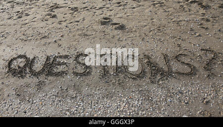 Any Questions writing on the beach sand Stock Photo - Alamy