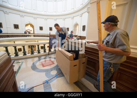Workers moving all 51 portraits of former Texas governors to make room ...