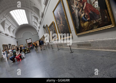 People inside a gallery at The Prado Museum in Madrid Spain looking at ...