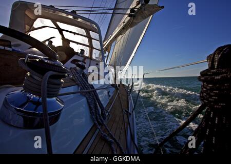 Sailing boat ship or yacht heeling over on sea in Southampton Water ...
