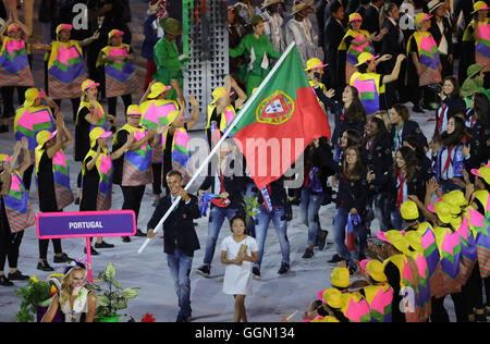 Joao Rodrigues carries the flag of Portugal during the opening ceremony ...