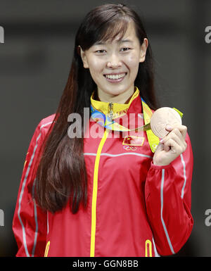 China's Sun Yiwen celebrates her bronze medal during a medal ceremony ...