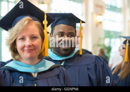 Graduation candidates in caps and gowns wait for Western Governors ...