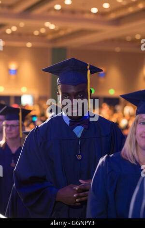 Graduation candidates in caps and gowns wait for Western Governors ...