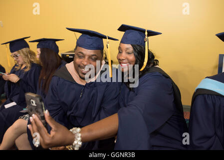 Graduation candidates in caps and gowns wait for Western Governors ...