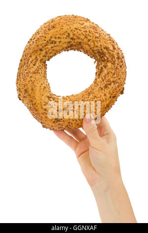 Female hand holding fresh bagel, isolated on white background Stock ...