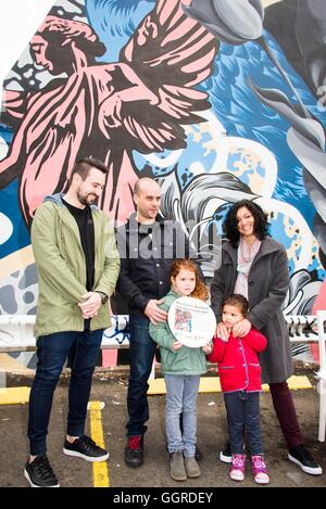 Street artist 'Alex Lehours' poses for a photograph with his newly ...