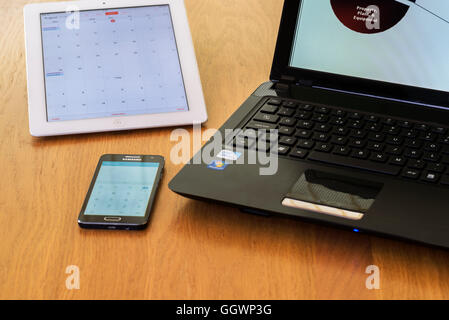 keyboard with phone and tablet pc on black background Stock Photo - Alamy