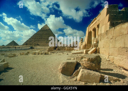 Restored mortuary temple facade and the Great Pyramid of Cheops at Giza ...
