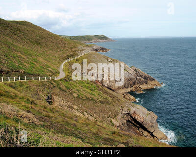 Steeply dipping carboniferous limestone beds forming sloping cliff line ...