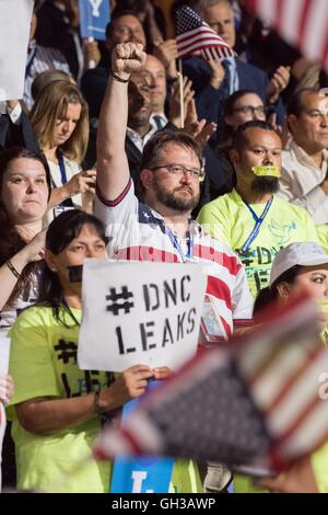 Democrats hold signs in protest as US President Donald J. Trump gives ...