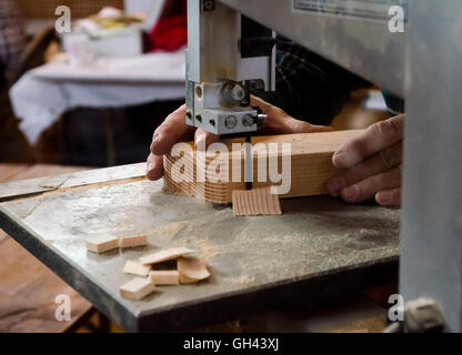Hands using a band saw Stock Photo - Alamy