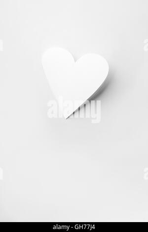 Real cutout white paper heart with shadow Stock Photo - Alamy