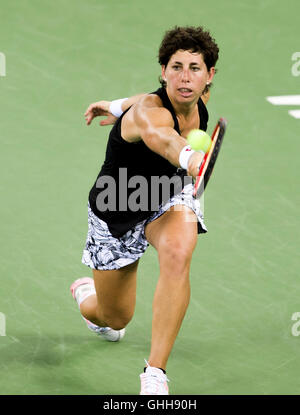 Spain's Carla Suarez Navarro returns a shot to China's Zhang Kailin ...