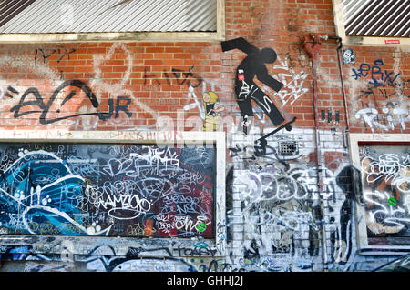 Graffiti tagging on red brick alleyway wall Cheltenham Stock Photo ...