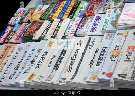 Newspaper headlines shown side on in a stack of daily newspapers Stock ...