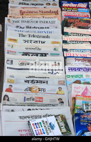 Newspaper headlines shown side on in a stack of daily newspapers Stock ...