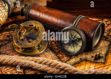 Old navigational instruments. Vintage telescope, sextant and quadrant ...