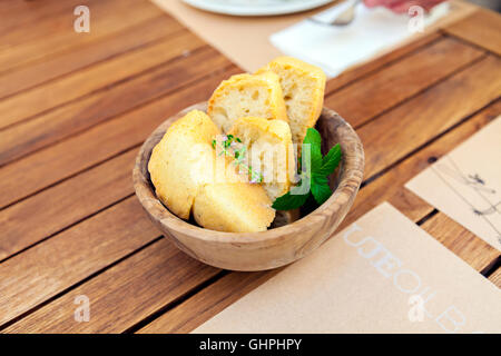 Fresh bread placed on a table with brown paper Stock Photo - Alamy