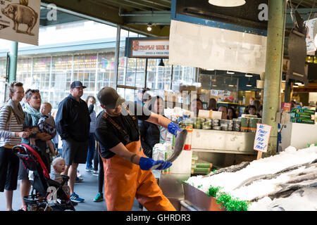 Seattle, Washington: Ryan throwing a fish at Pike Place Fish Market ...