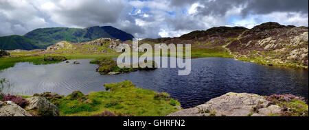 Innominate Tarn on Haystacks, looking across to surrounding mountains ...