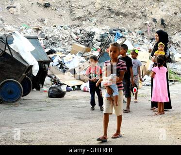 Palestinian children stand on an area surrounded by makeshift tents in ...