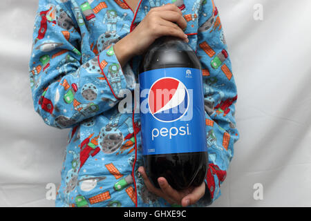 A child holding Pepsi soft drink Stock Photo - Alamy