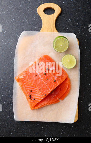 raw salmon fillet on a wooden board Stock Photo - Alamy