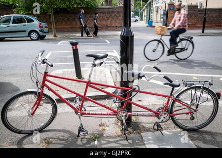 Three seater tandem bicycle Stock Photo - Alamy